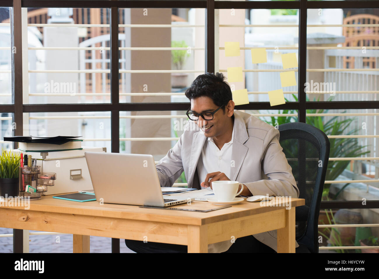 indian male working from office Stock Photo - Alamy