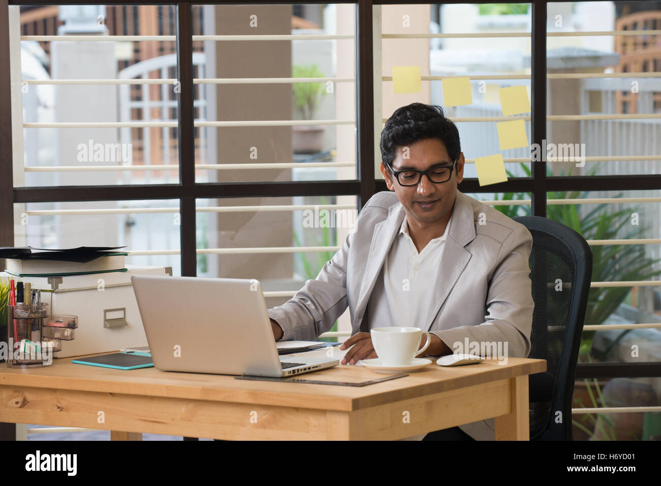 indian male working from office Stock Photo - Alamy