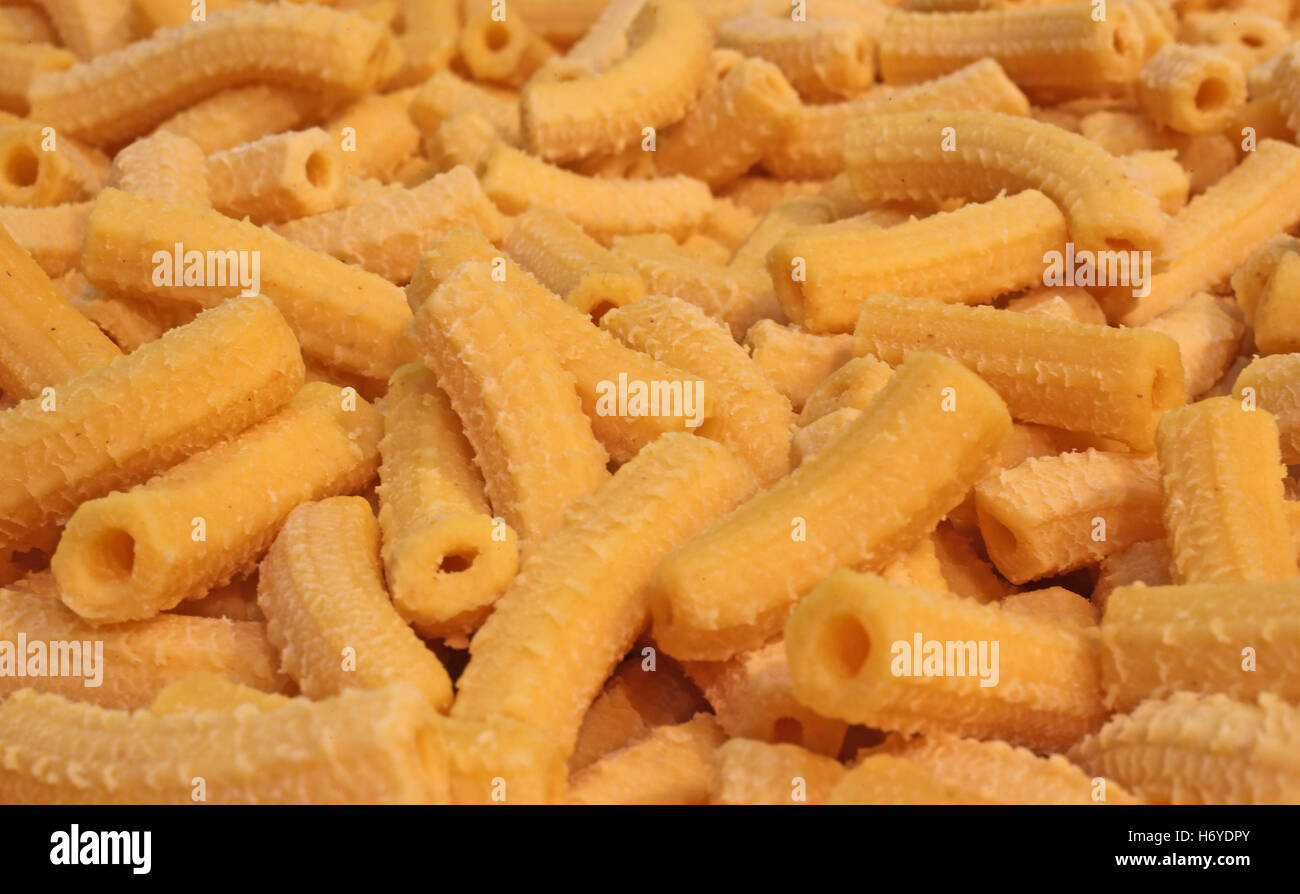 yellow macaroni dry fresh pasta in the shape of small tubes Stock Photo ...