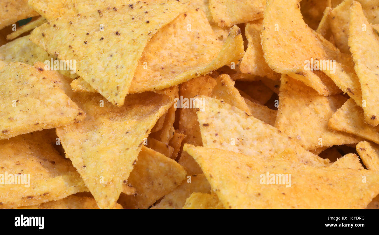 background of Fragrant Mexican yellow tortillas chips with a lot of ...