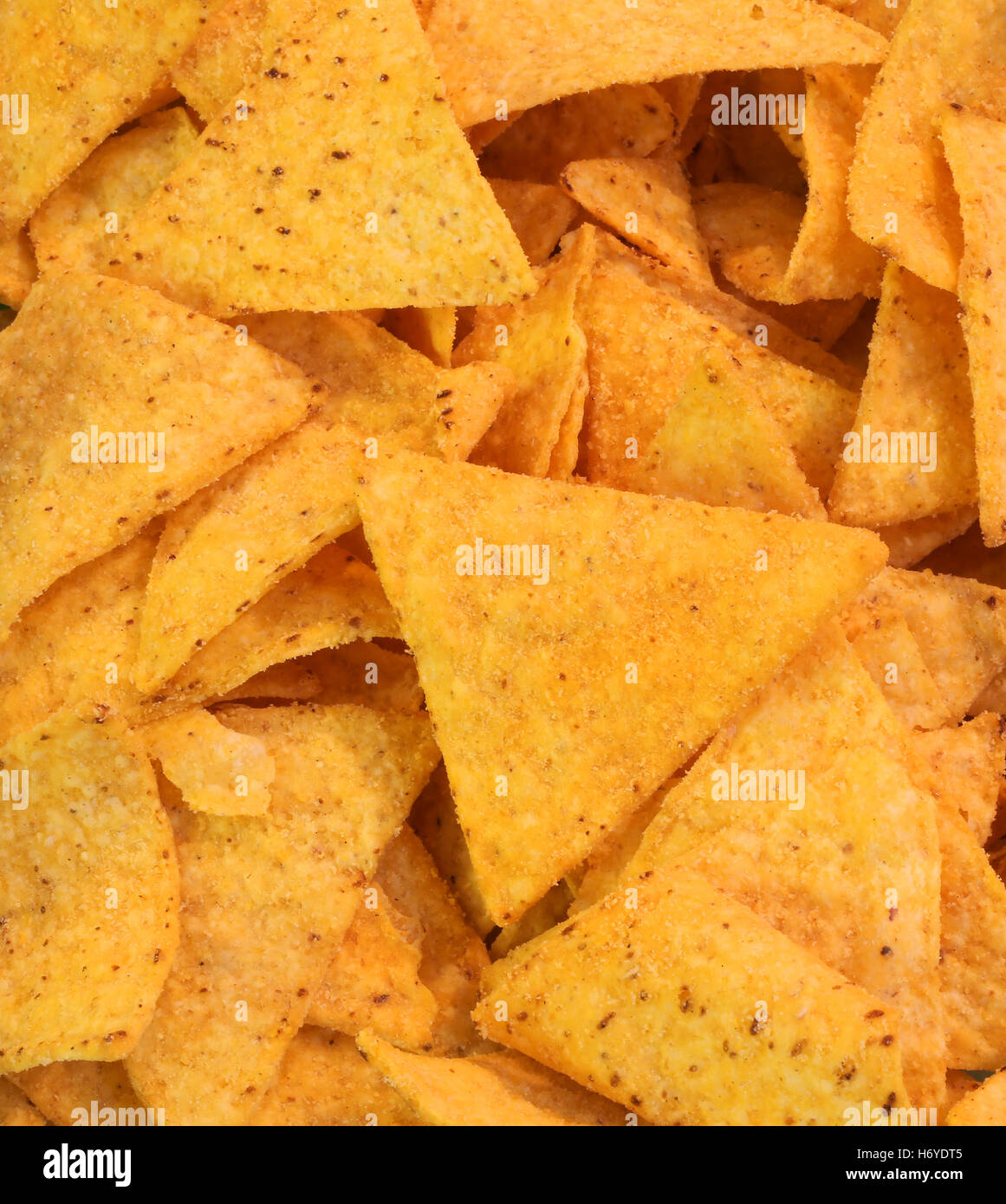 background of Fragrant yellow tortillas chips with a lot of salt Stock ...