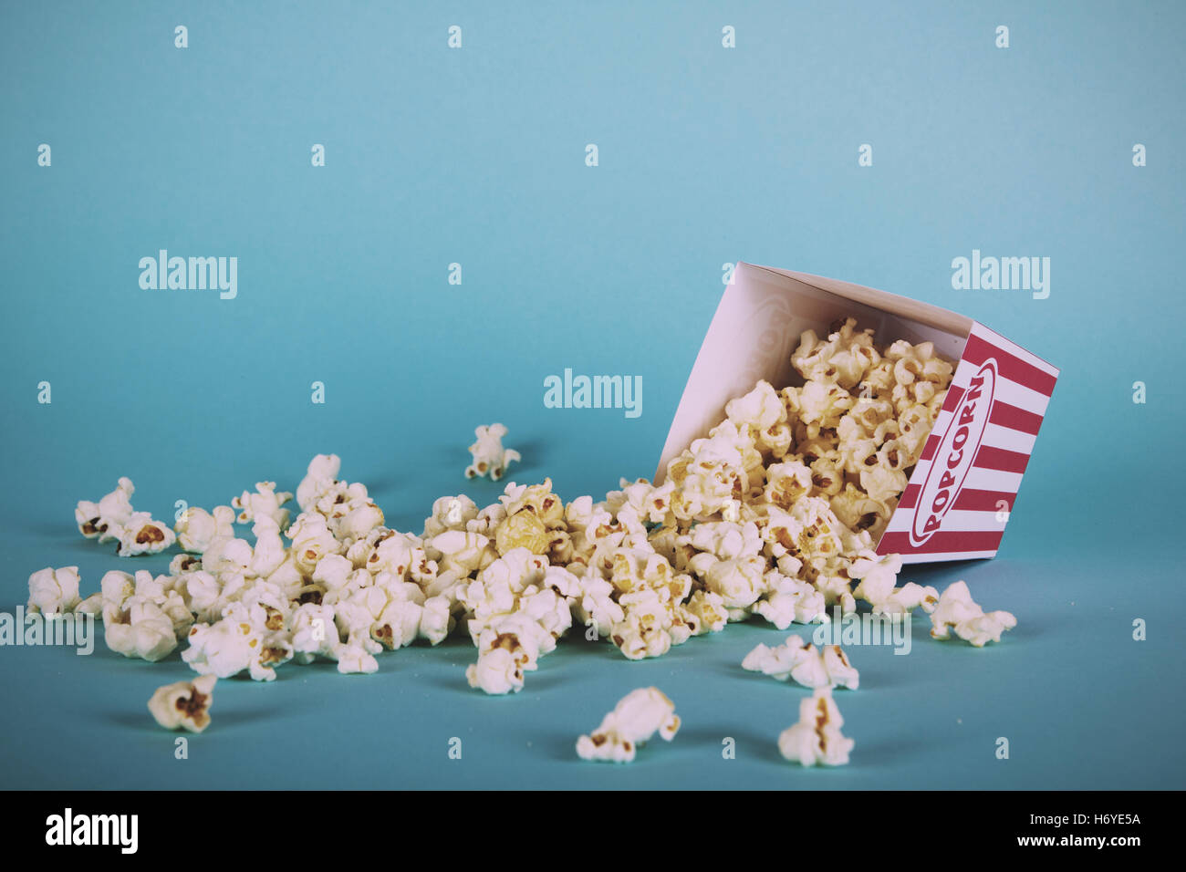 Bucket of popcorn against a blue background Vintage Retro Filter Stock ...