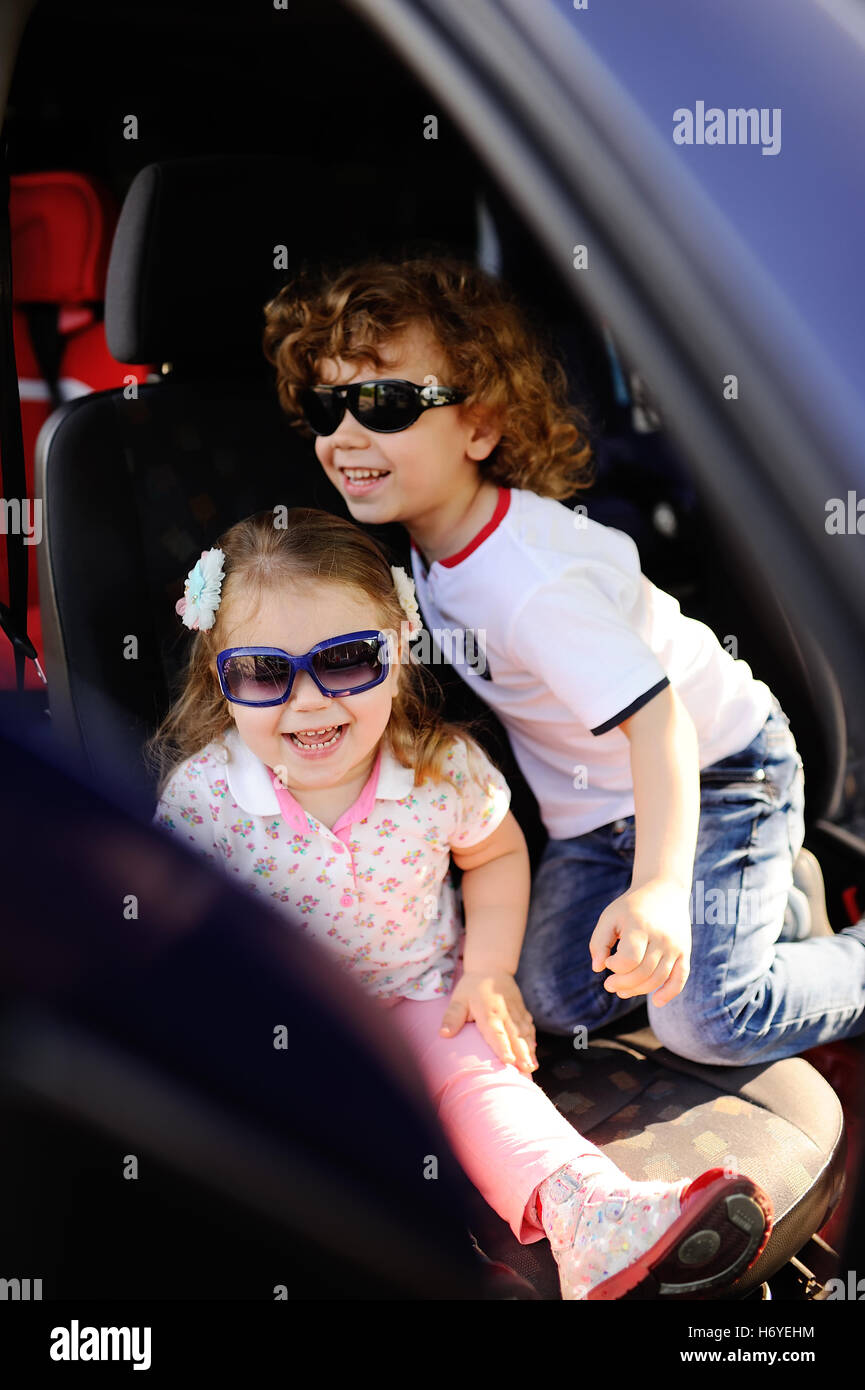 children sit in the car and play Stock Photo - Alamy