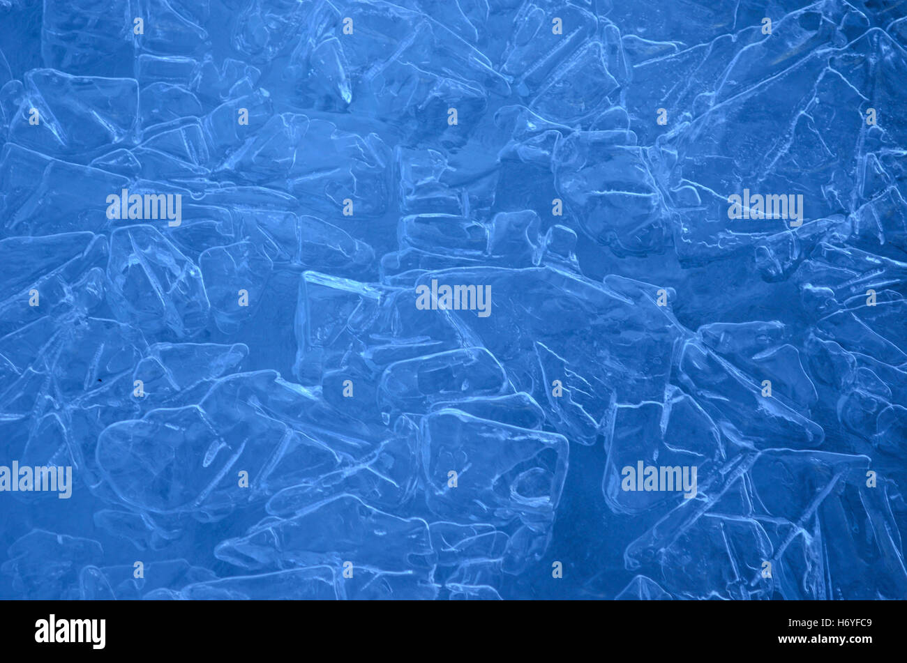 beautiful shapes on blue river ice background Stock Photo - Alamy