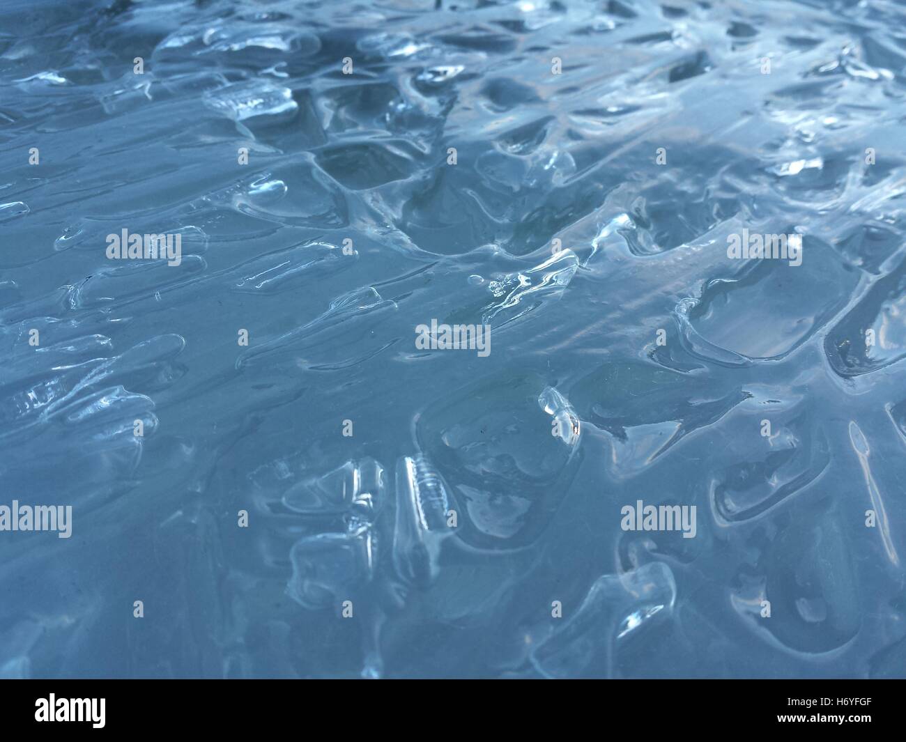 beautiful fresh water blue ice background in northern wilderness Stock ...