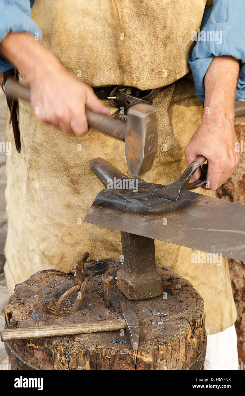 blacksmith at work in the repair shop in italy Stock Photo - Alamy