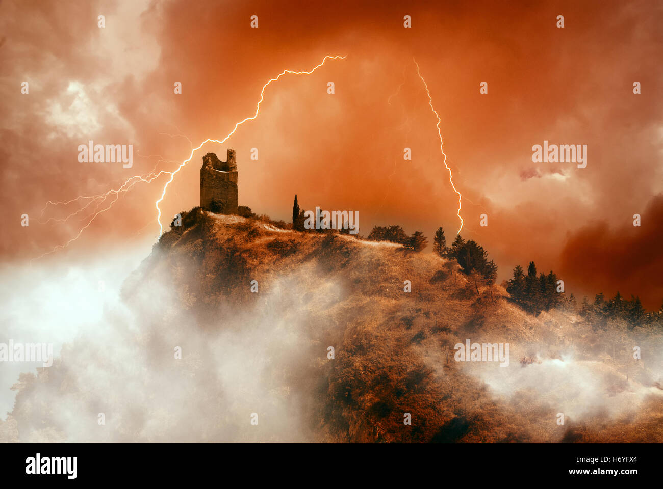old tower on the mountain with lightning Stock Photo - Alamy
