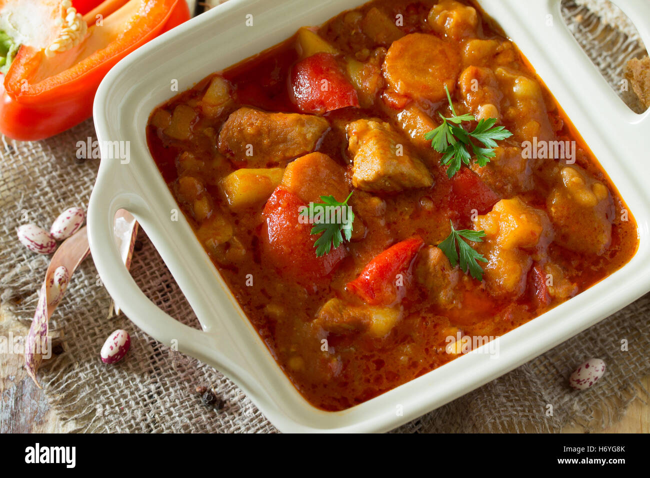 Traditional hot ragout with meat, paprika and beans, stewed in tomato ...
