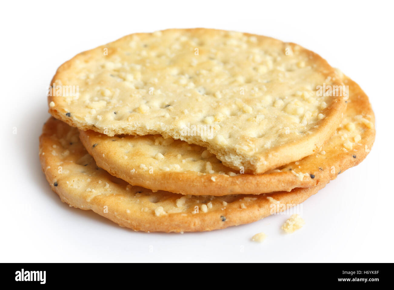 Three golden cheese crackers on white Stock Photo - Alamy