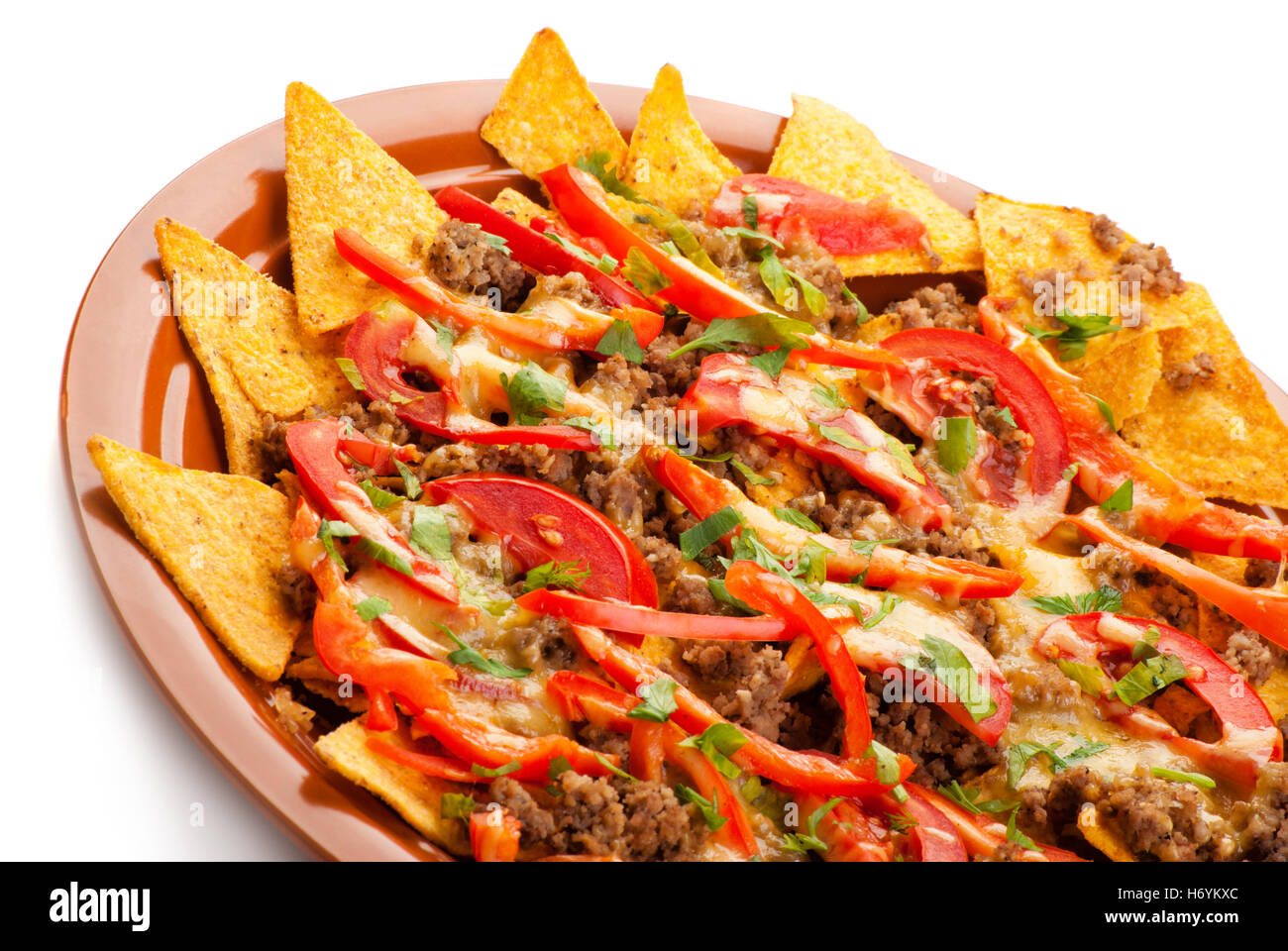 spicy nachos with pork, tomato and pepper Stock Photo - Alamy