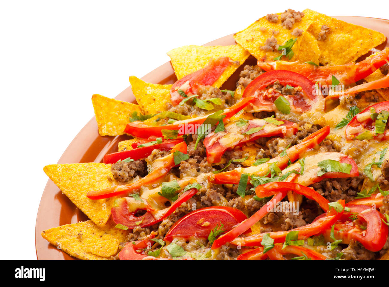 spicy nachos with pork, tomato and pepper Stock Photo - Alamy