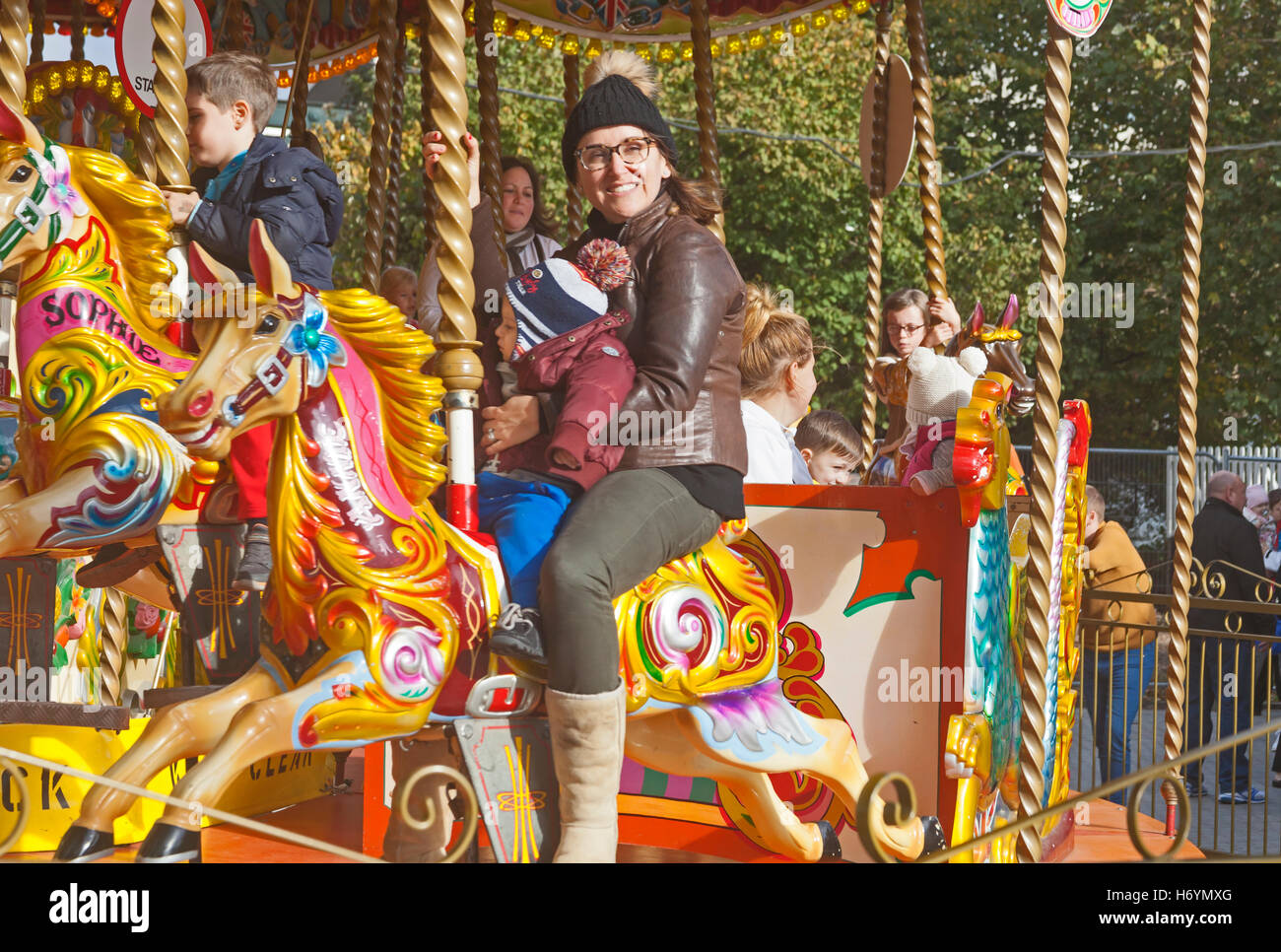 London, South Bank A traditional carousel in action at Jubilee Garden ...
