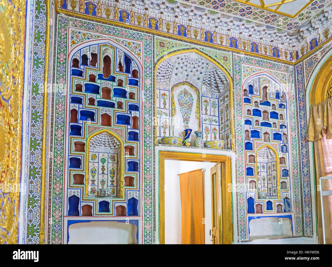 The wall decorated with the colorful shelves for the porcelain ...