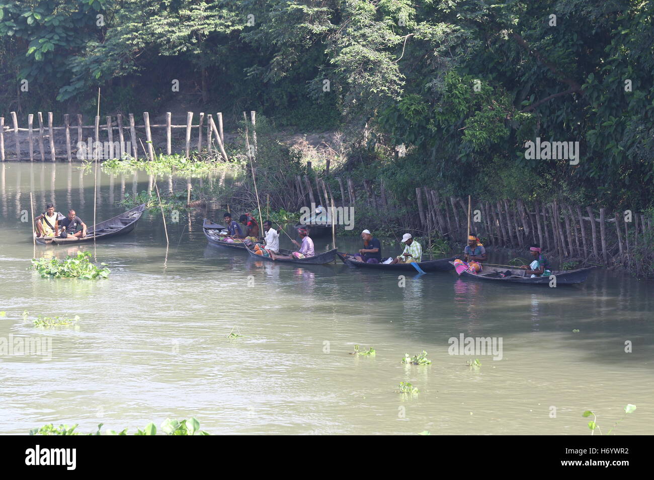 Seasonal fishermen busy fishing in the Turag river at Savar outside the ...