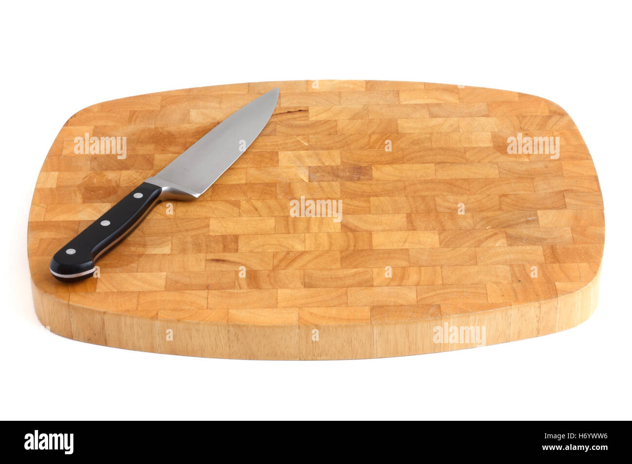 Traditional thick chopping board with a cooks knife Stock Photo - Alamy