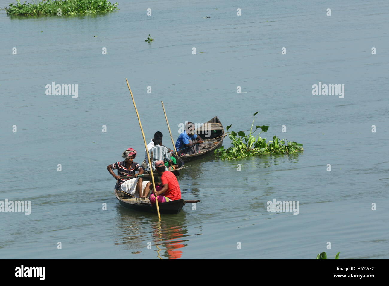 Seasonal fishermen busy fishing in the Turag river at Savar outside the ...