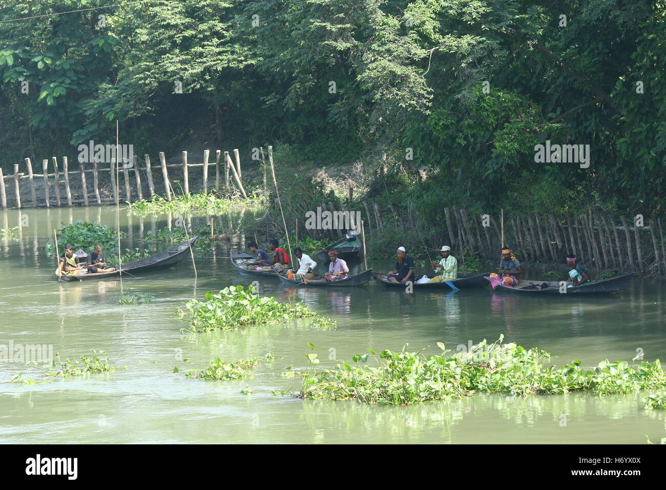 Seasonal fishermen busy fishing in the Turag river at Savar outside the ...