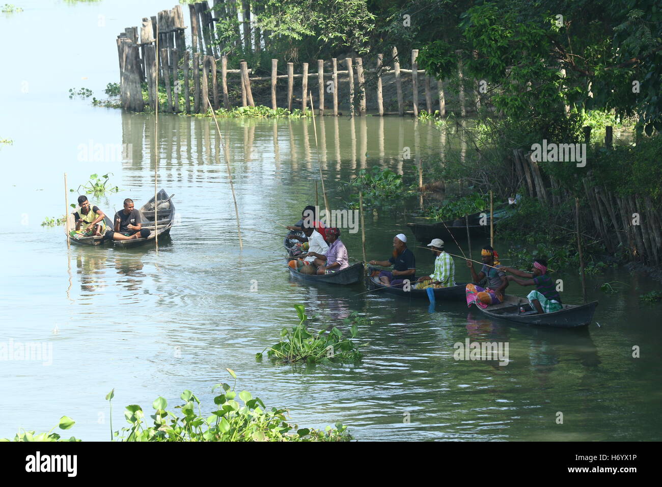 Seasonal fishermen busy fishing in the Turag river at Savar outside the ...