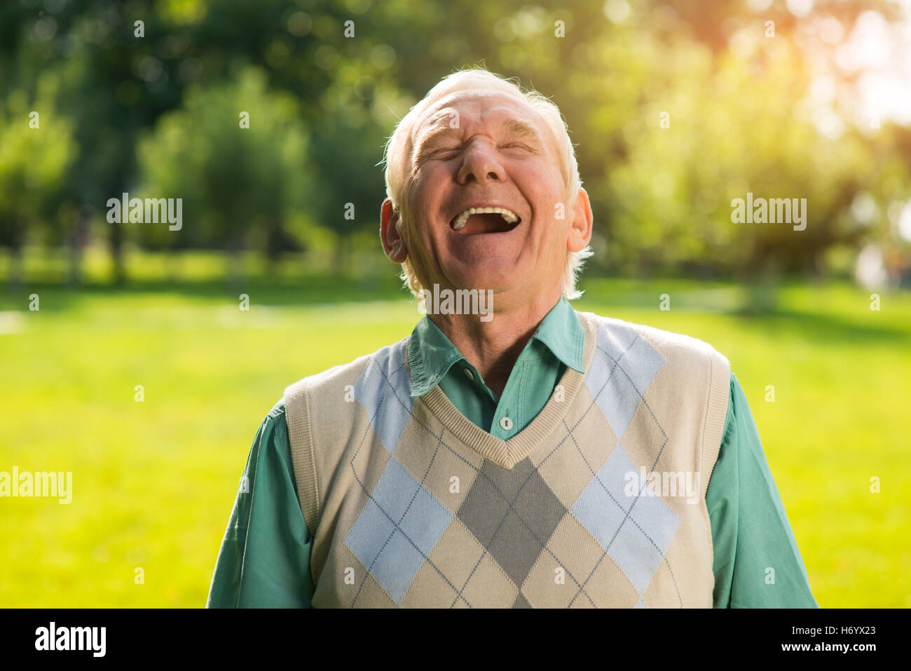 Elderly man laughing Stock Photo - Alamy