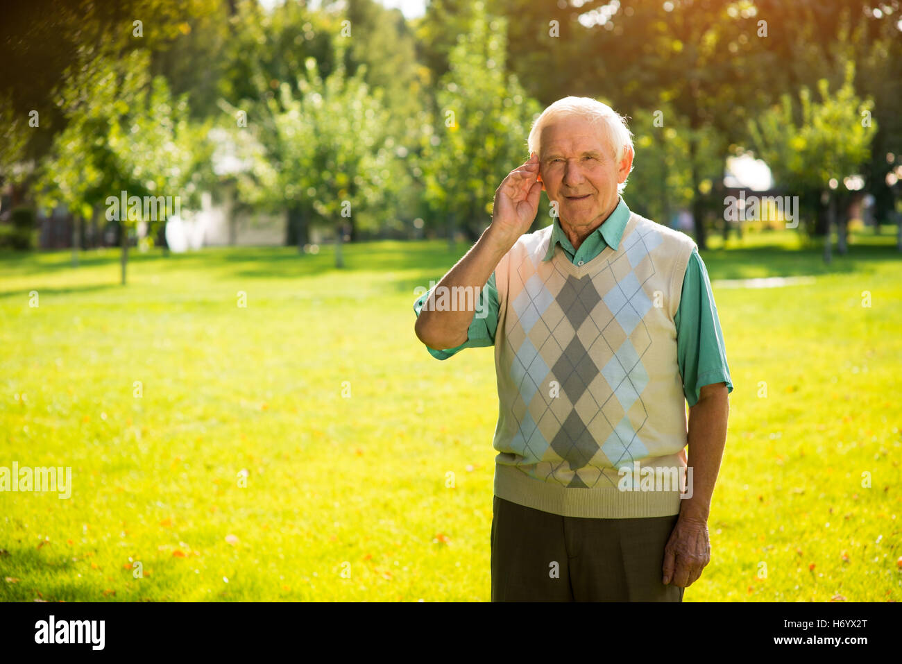 Senior man touching his temple Stock Photo - Alamy Senior man touching his temple Stock Photo - Alamy