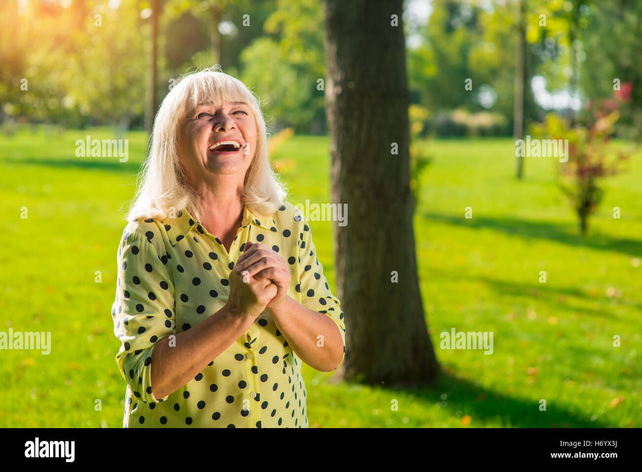 Elderly woman laughing Stock Photo - Alamy