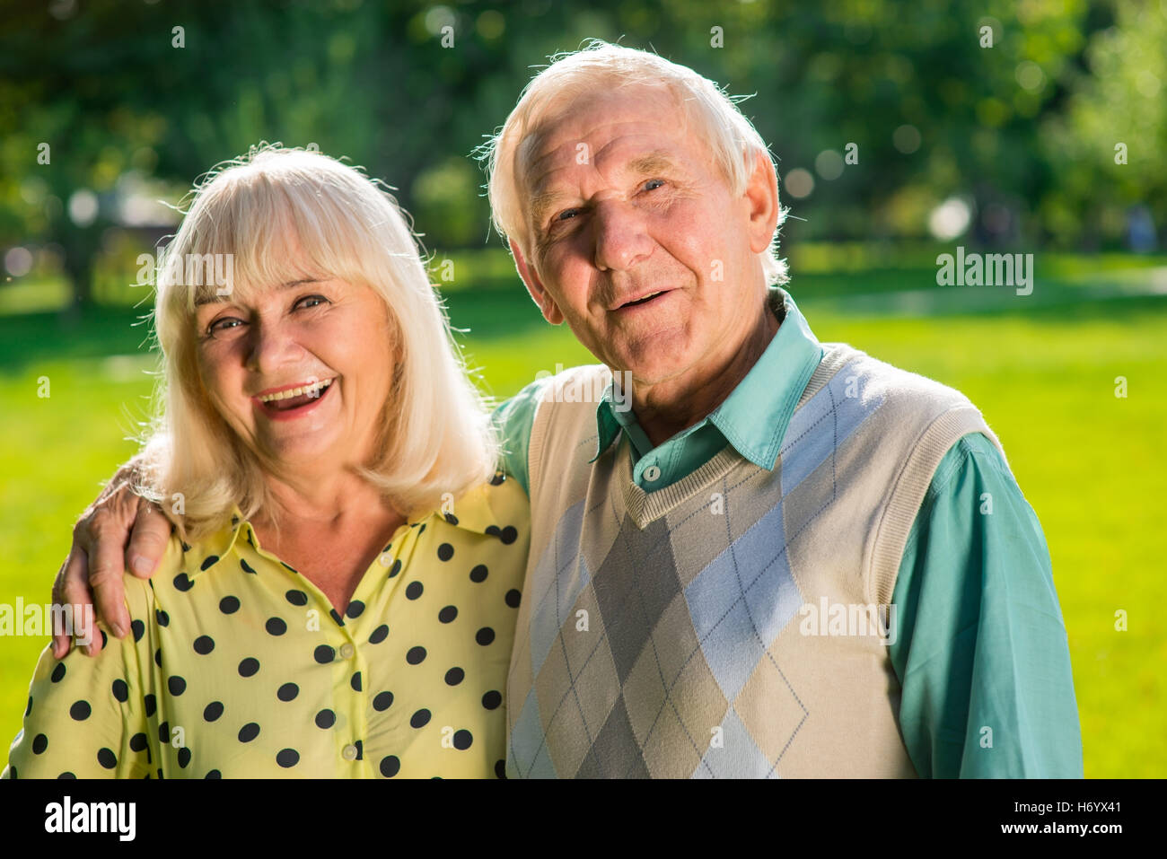 Senior man hugging woman Stock Photo - Alamy