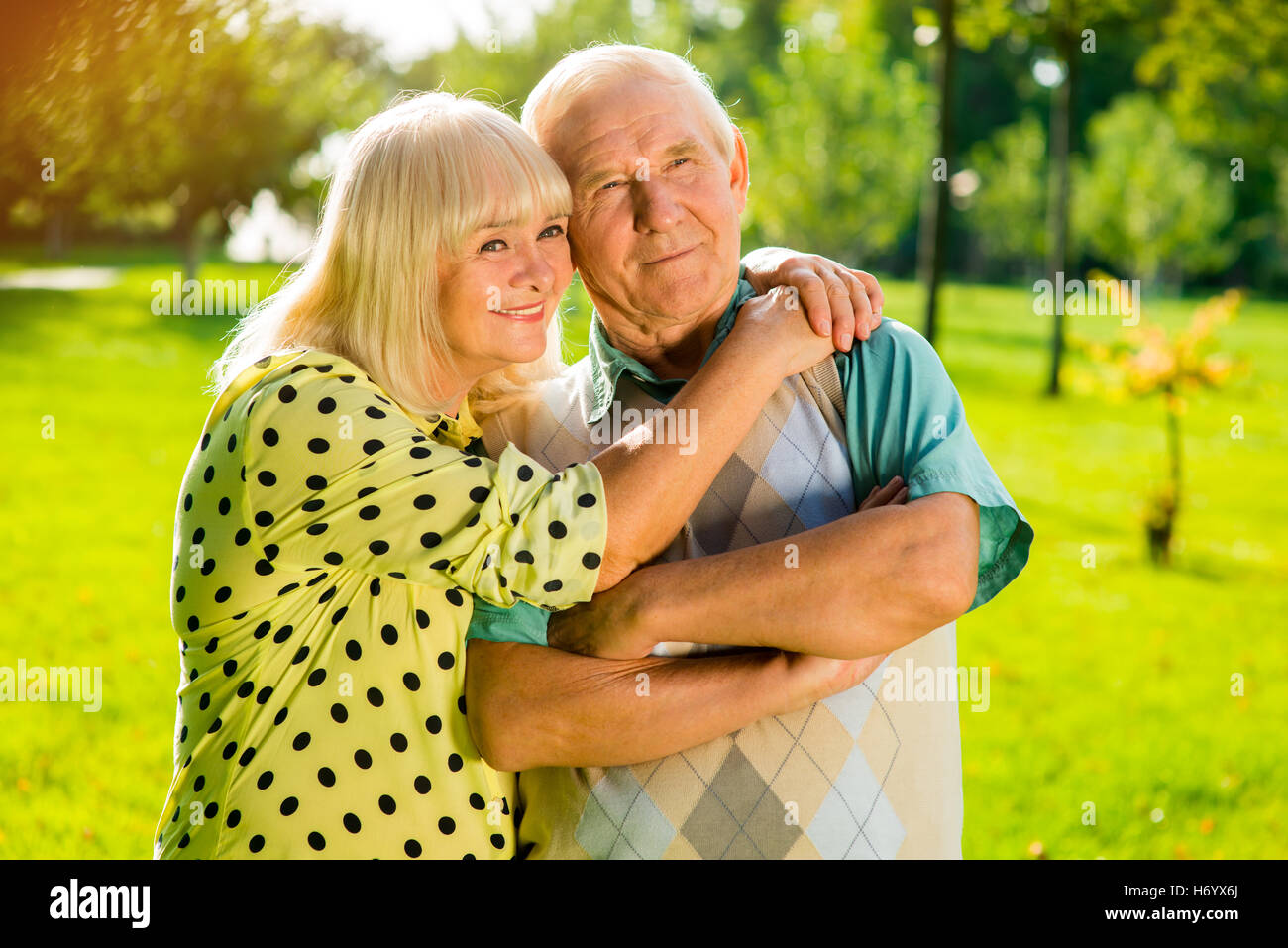 Senior woman hugging man Stock Photo - Alamy