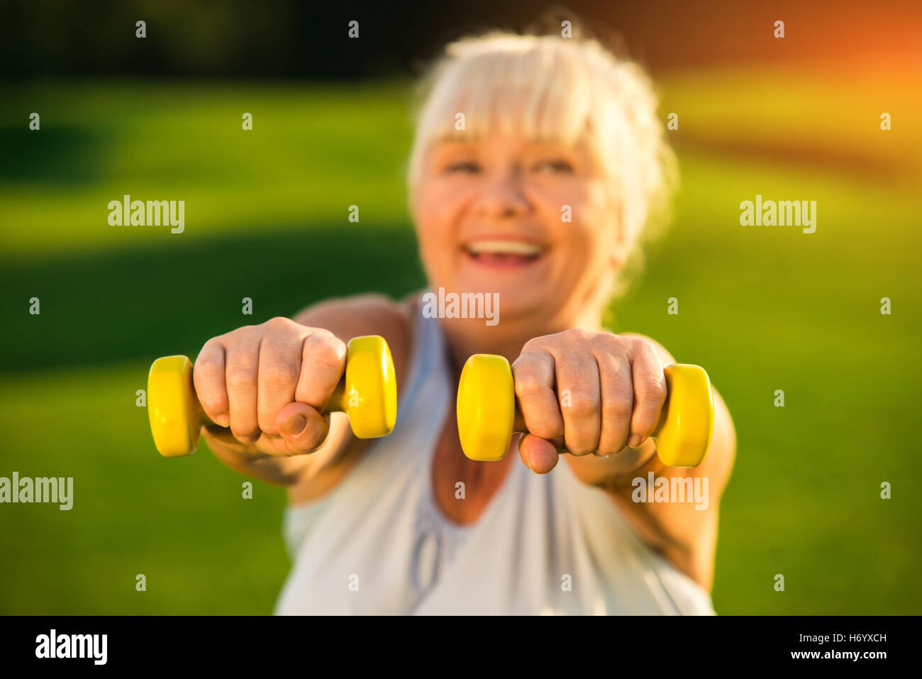 Older woman training dumbbells hi-res stock photography and images - Alamy