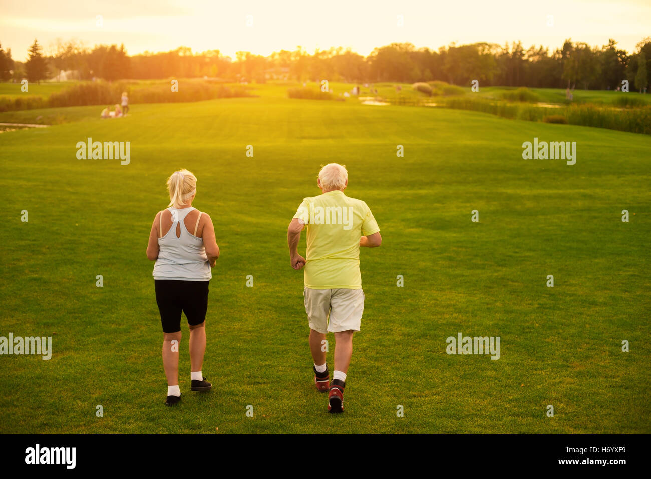 Back view of jogging couple Stock Photo - Alamy