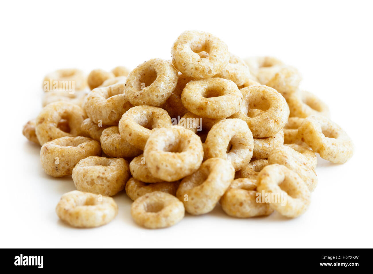 Heap of honey cheerios isolated on white Stock Photo - Alamy