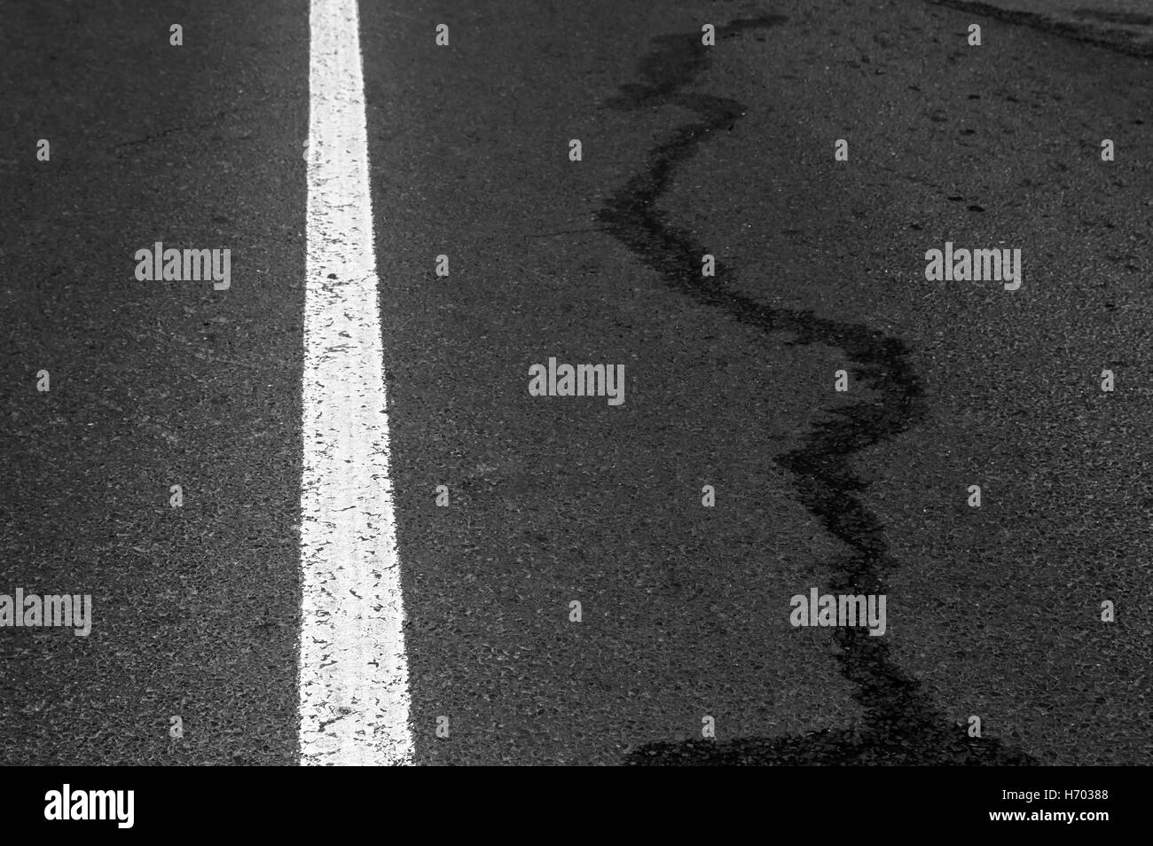 White grunge line on asphalt road Stock Photo - Alamy