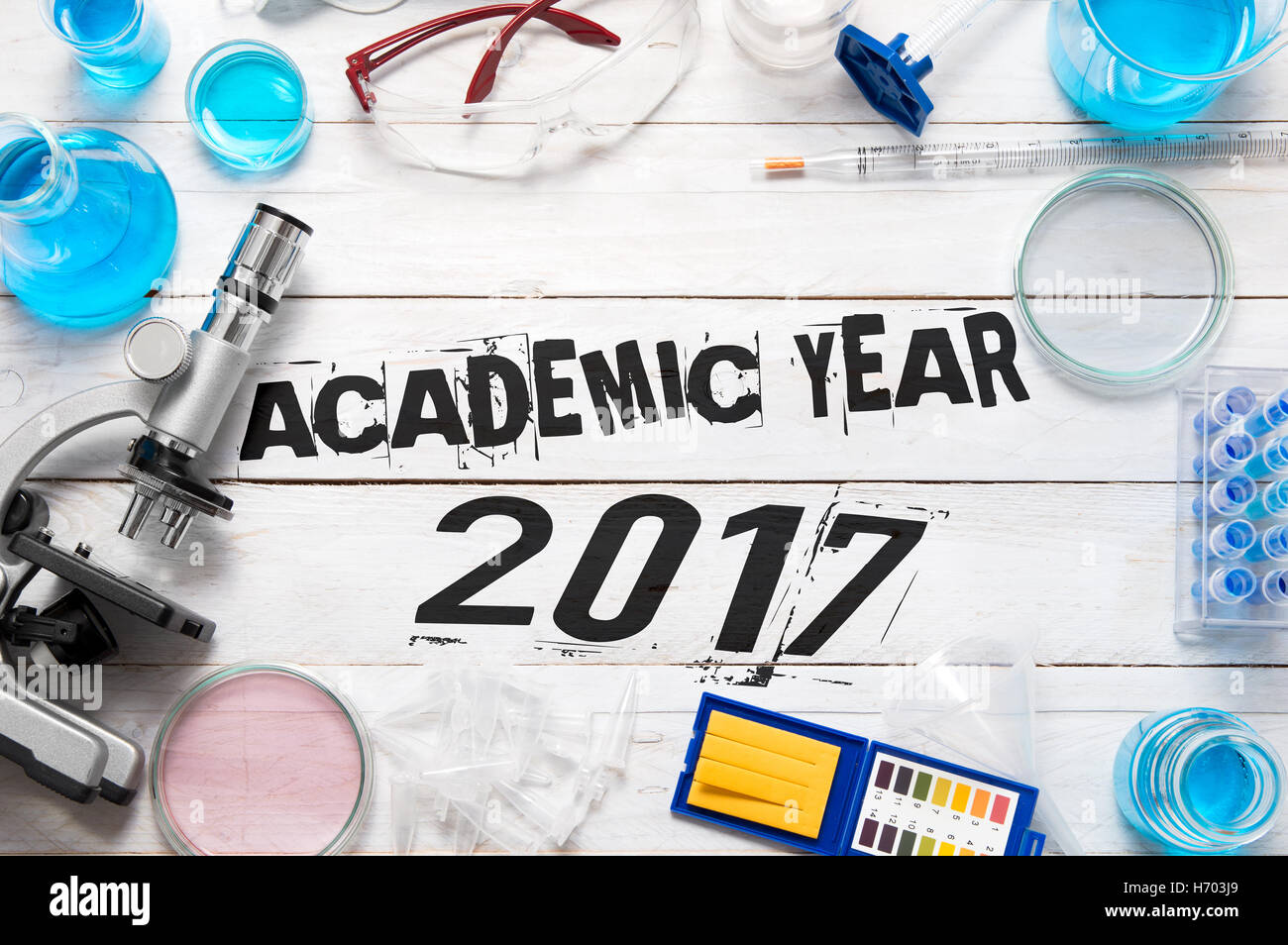 Sign "Academic year 2017" on the white desk with scientific school ...