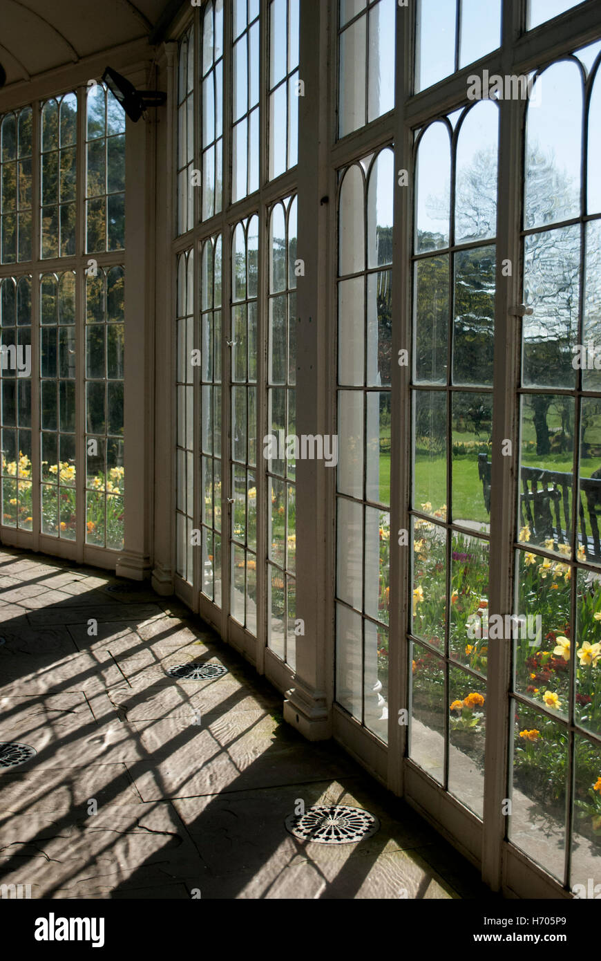 View through old conservatory to garden and blue sky Stock Photo - Alamy