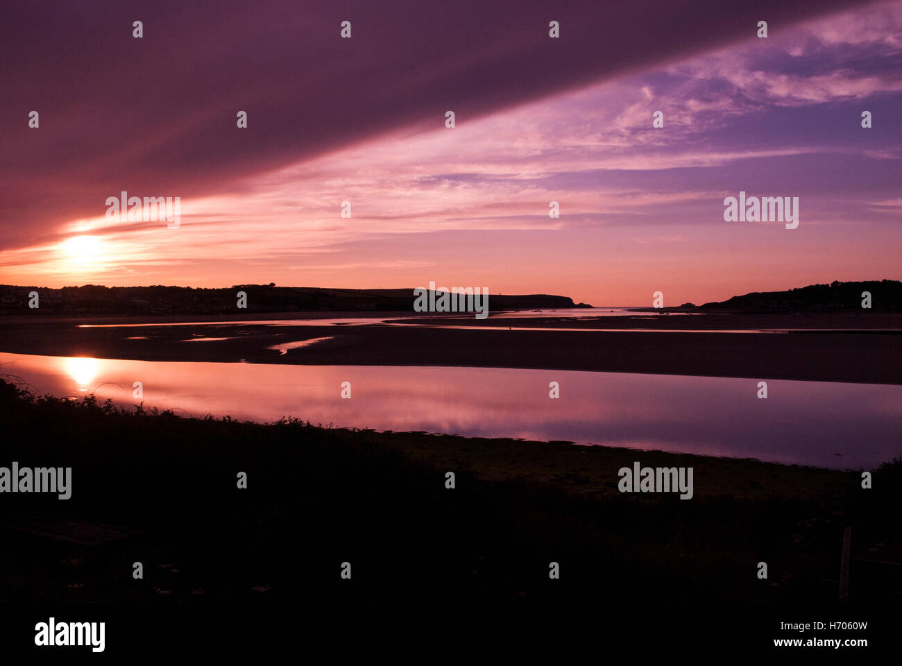 Sunset of many colors and silhouettes Stock Photo - Alamy