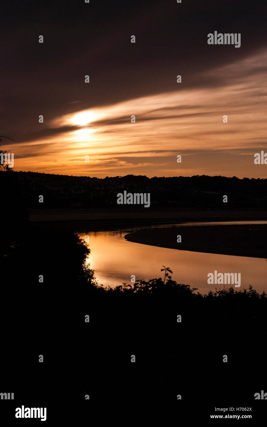 Sunset of many colors and silhouettes Stock Photo - Alamy