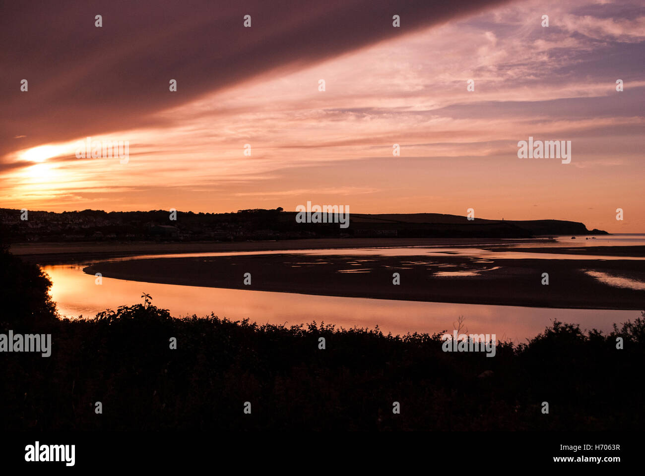 Sunset of many colors and silhouettes Stock Photo - Alamy