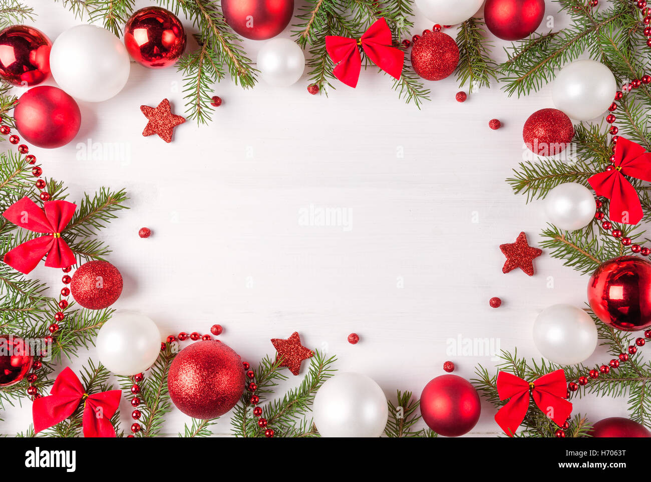Christmas light frame decorated with red and white baubles, bows and ...