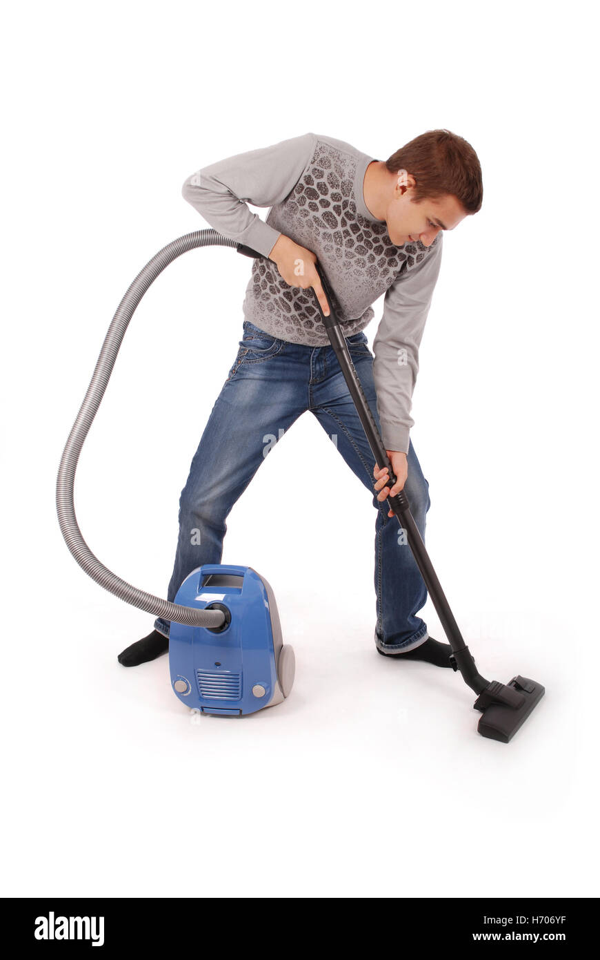 Boy with vacuum cleaner isolated on white background Stock Photo - Alamy