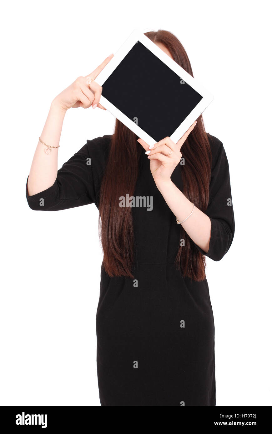 Girl keeps tablet pc the face isolated on white Stock Photo - Alamy