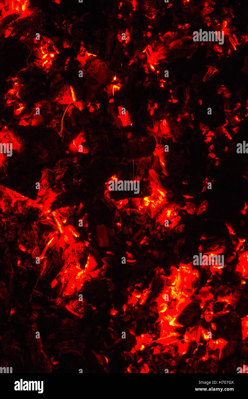 Red hot fire embers at night. close up background Stock Photo - Alamy