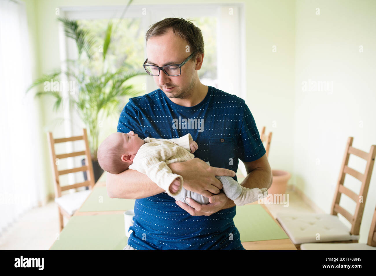 Father holding newborn baby in hi-res stock photography and images - Alamy