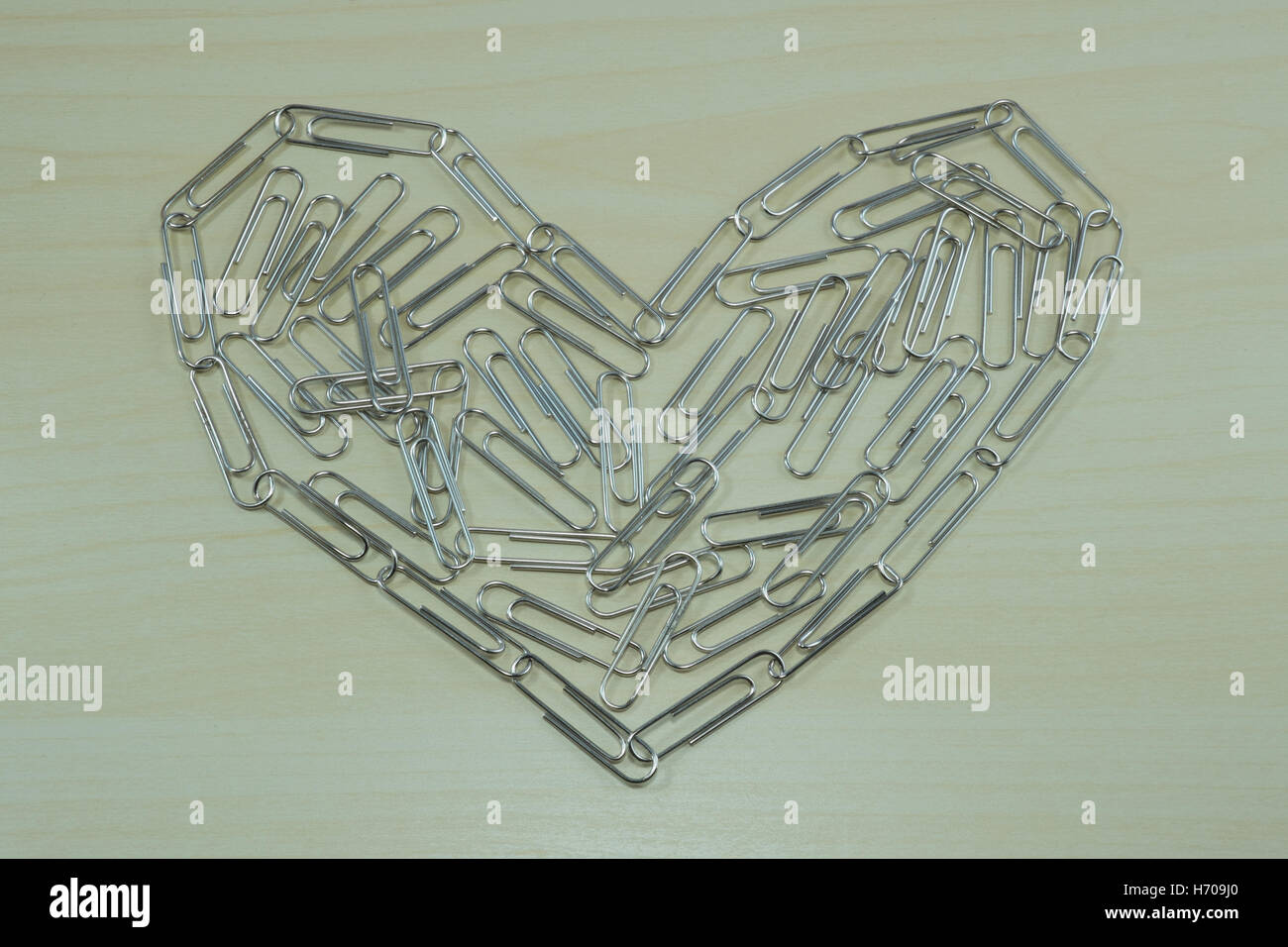 Paper-clips in heart shape Stock Photo - Alamy