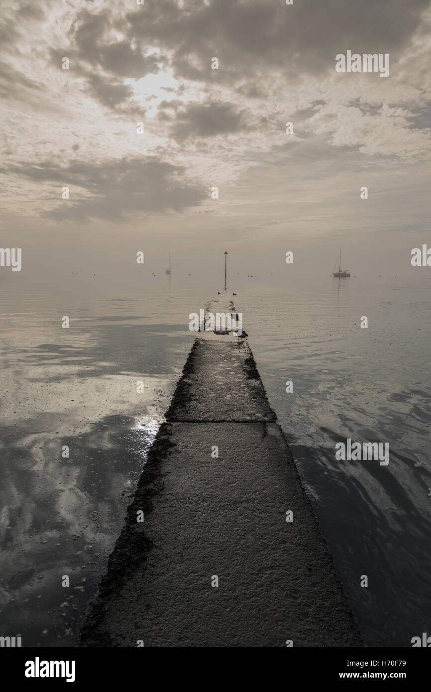 Yacht at Anchor on Flat Calm Sea off Chalkwell Stock Photo - Alamy