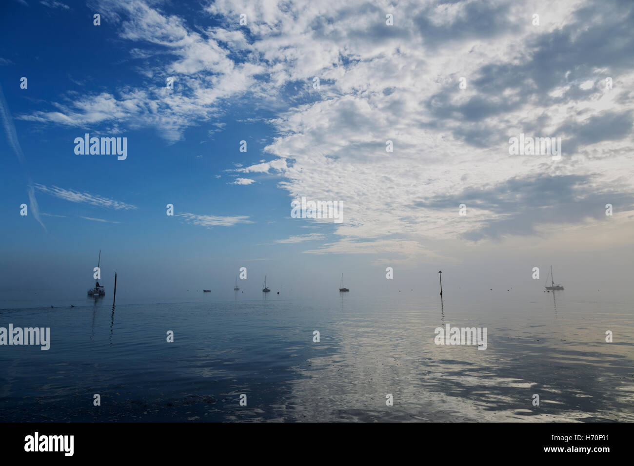 Various Yachts at Rest on Flat Calm Sea off Chalkwell Stock Photo - Alamy
