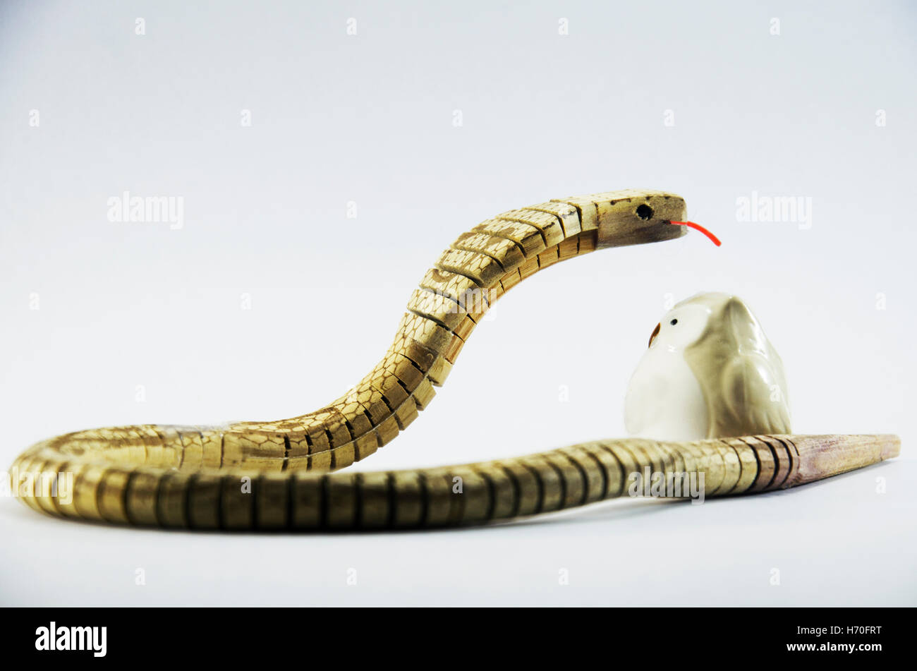King cobra snake toy made from wood with ceramic owl bird doll Stock ...