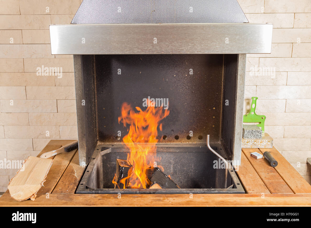 Wood burning in the outdoor barbeque oven Stock Photo - Alamy