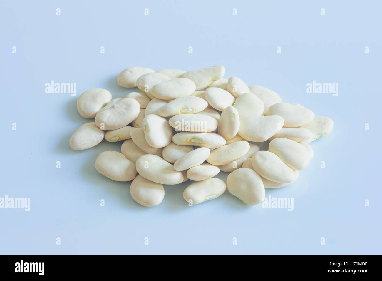Big white beans on a white background Stock Photo - Alamy