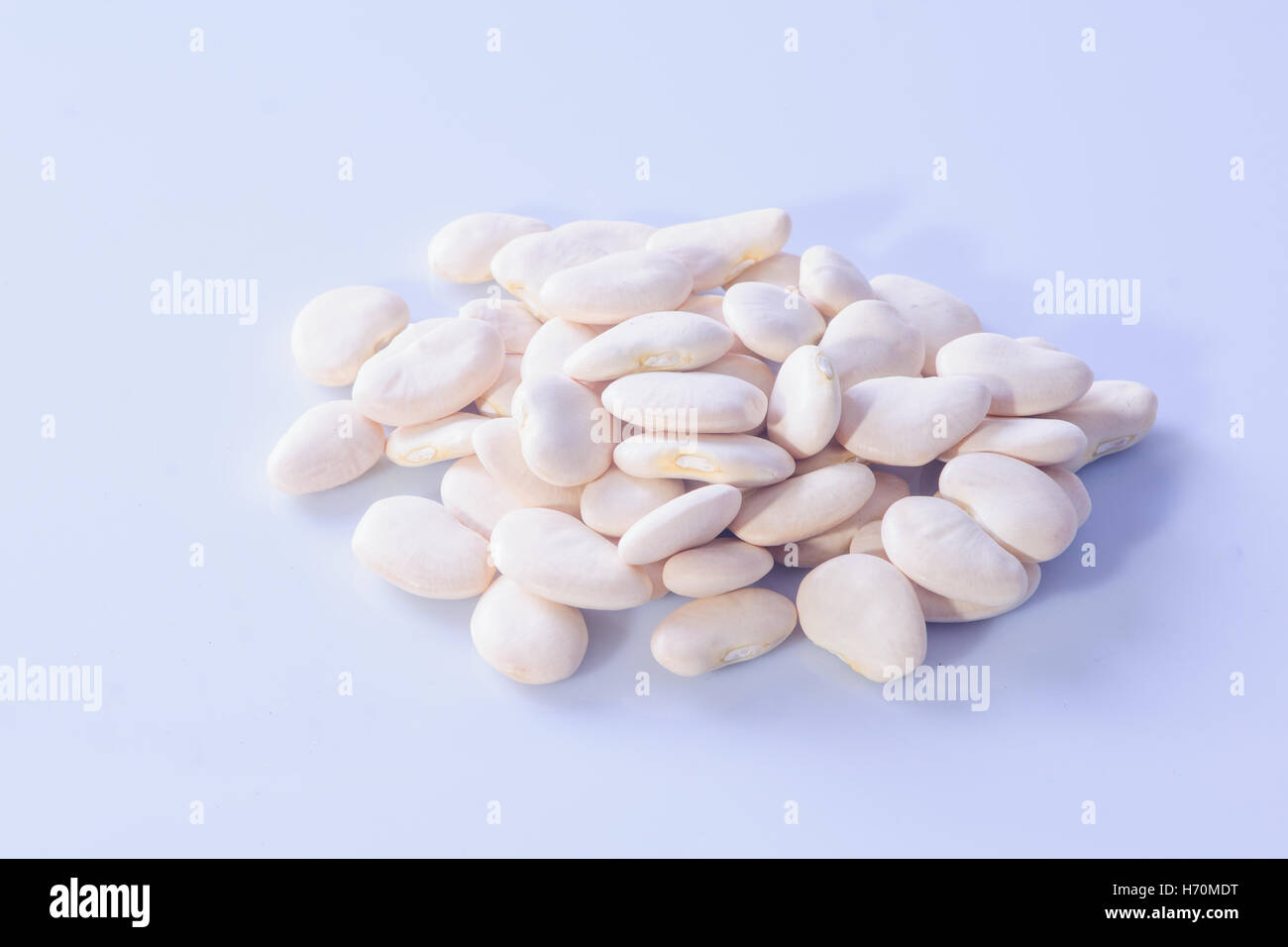 Big white beans on a white background Stock Photo - Alamy