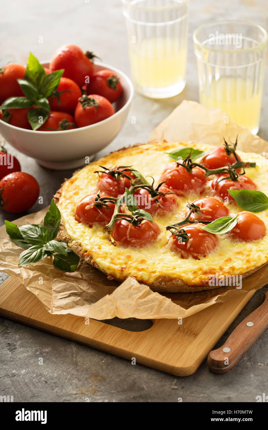 Savory rustic cheese tart with cherry tomatoes Stock Photo - Alamy