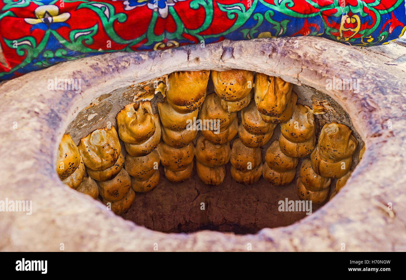 The samsa cakes with meat are the popular street food, baked in tandoor ...